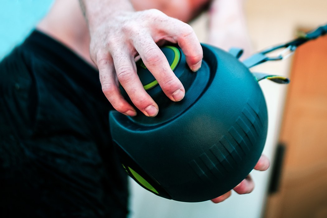 This medicine-ball shaped device is a complete resistance training gym ...