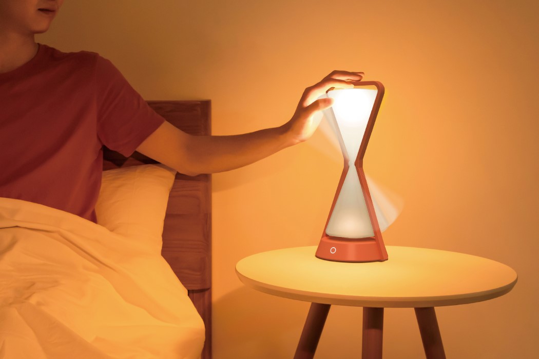 Hourglass-shaped table lamp helps you keep track of time using ambient ...